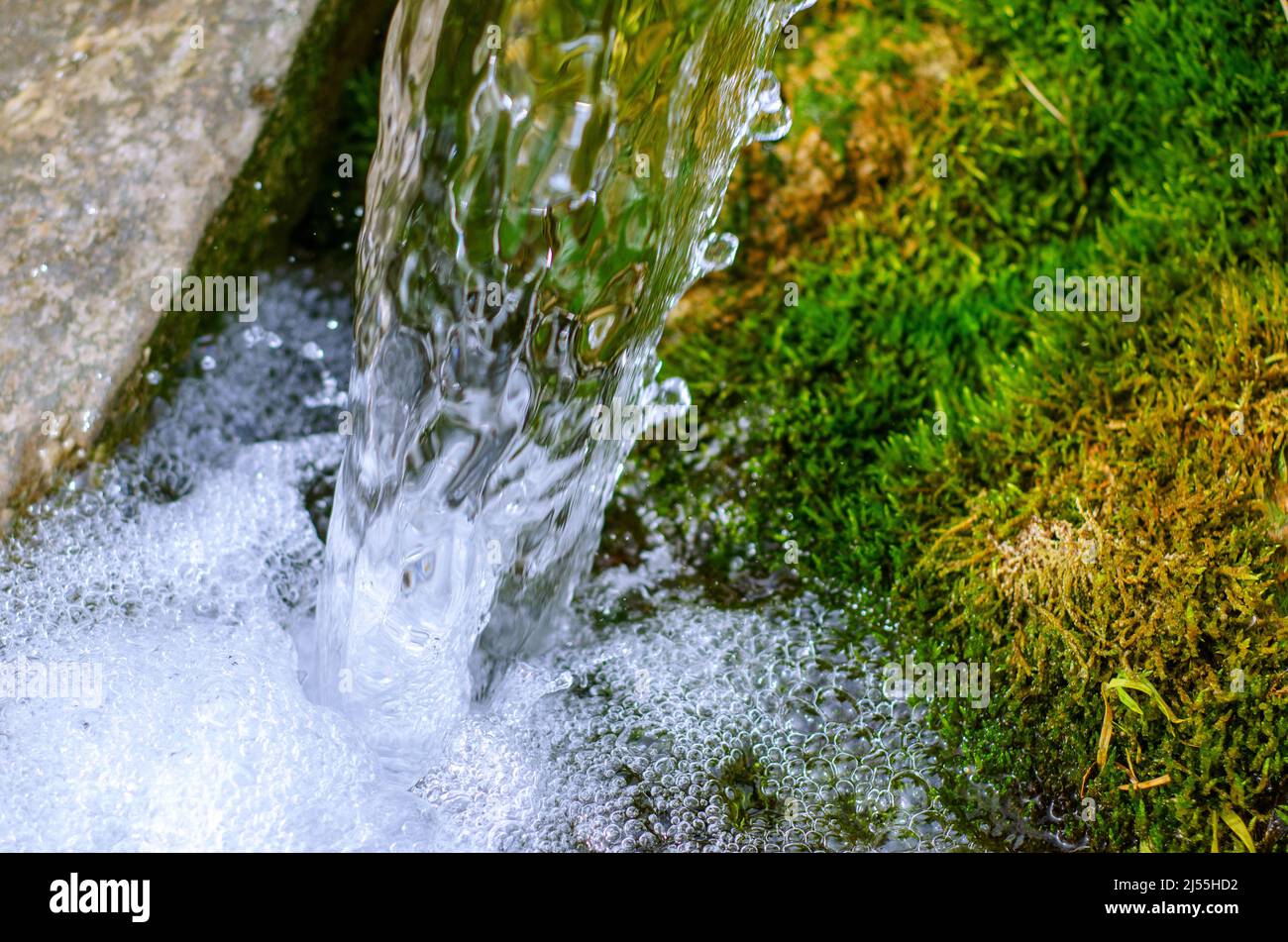 Pleasant freshness of cold running water. Crystal source in natural ...