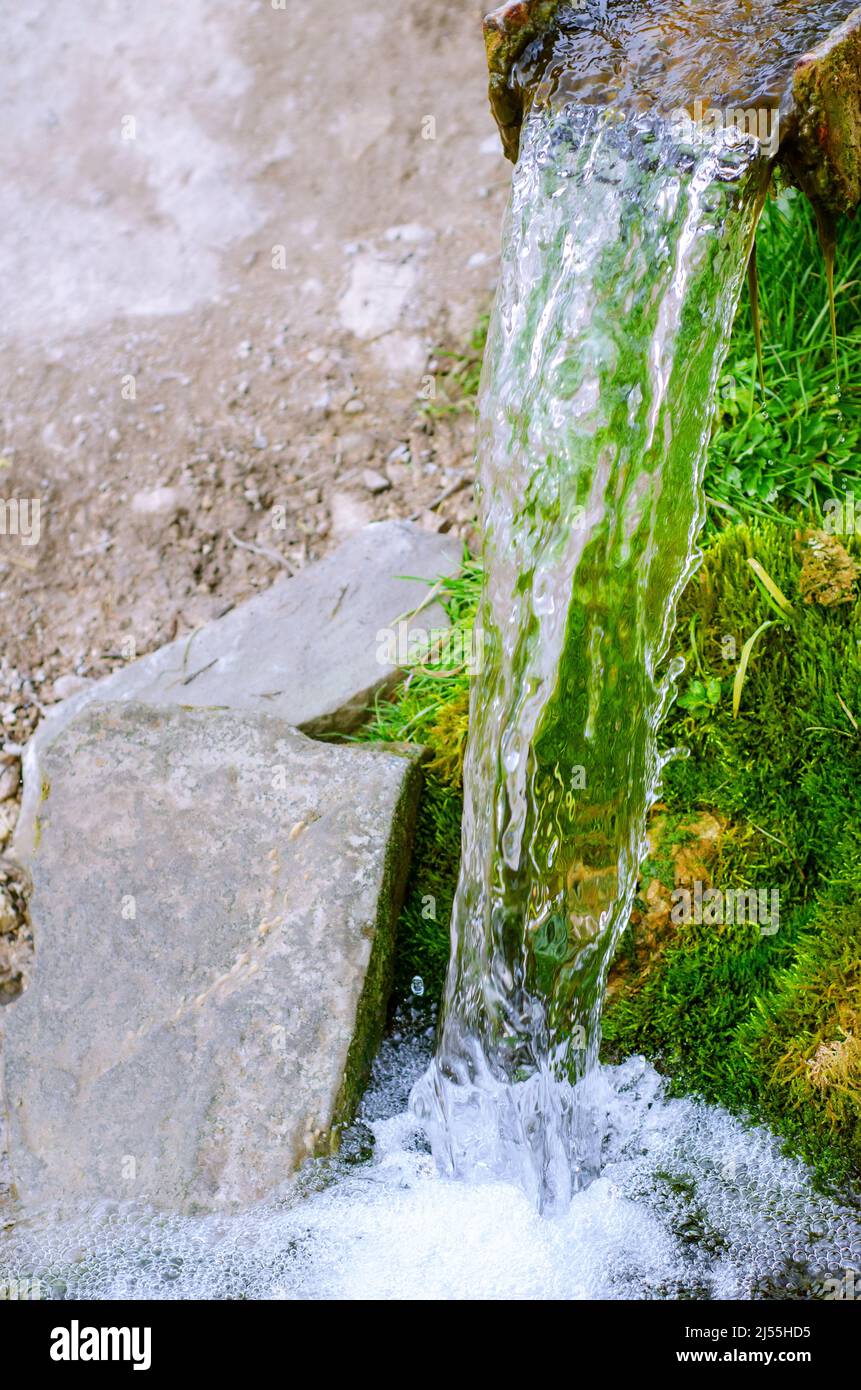 Falling stream of fresh clean spring water. Energy of nature Stock ...