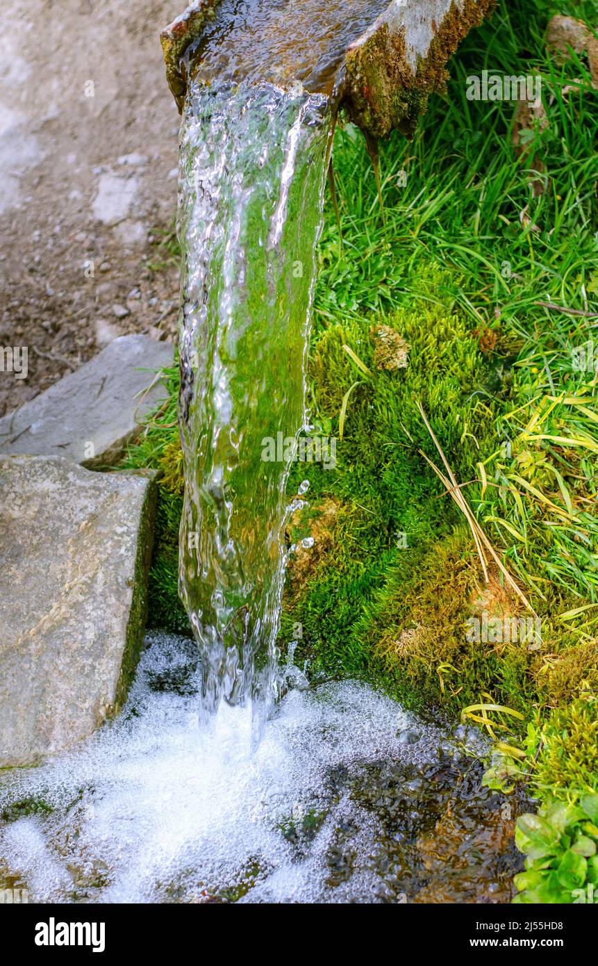 Falling stream of fresh clean spring water. Energy of nature Stock ...