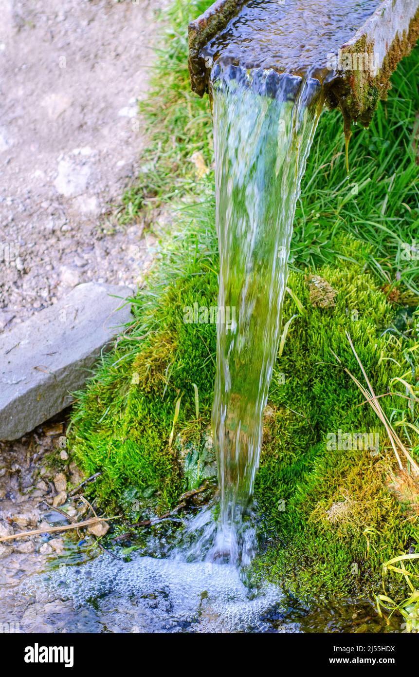 Falling stream of fresh clean spring water. Energy of nature Stock ...
