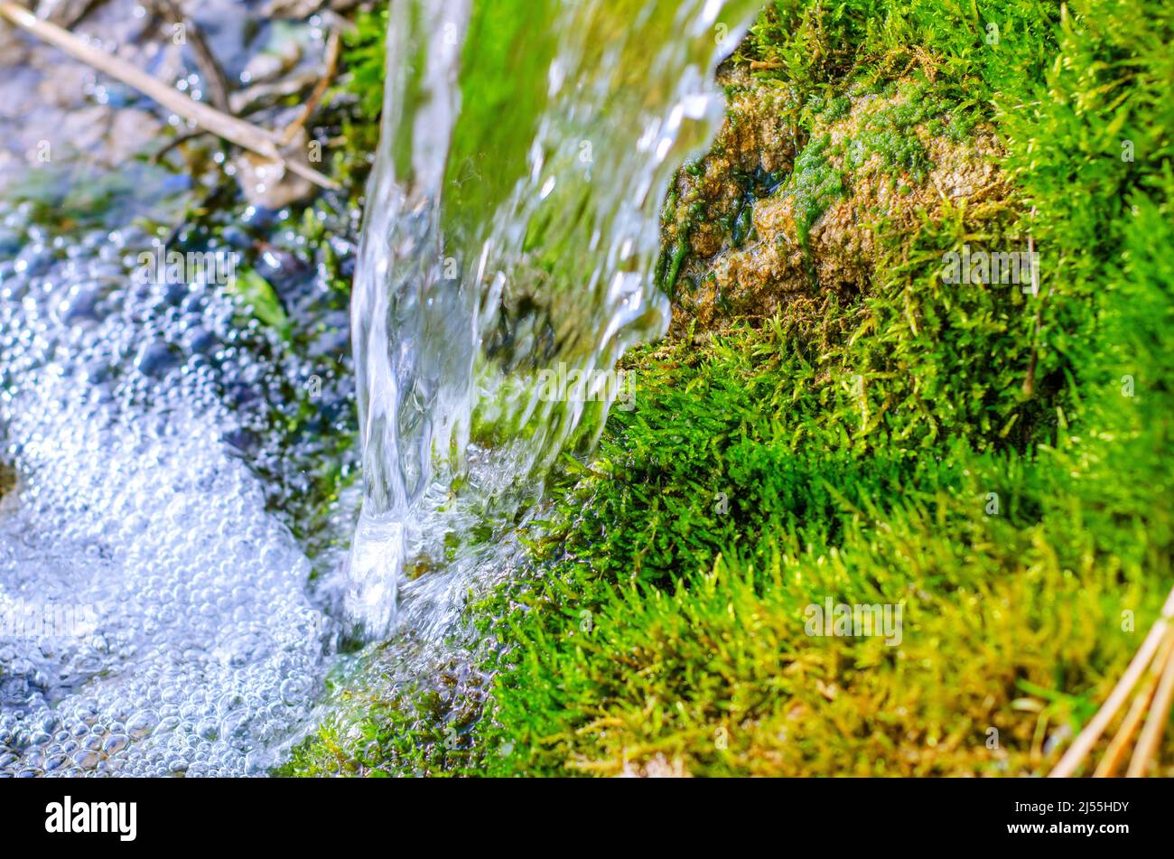 Beautiful screensaver with water background. Fflow of clean fresh water ...