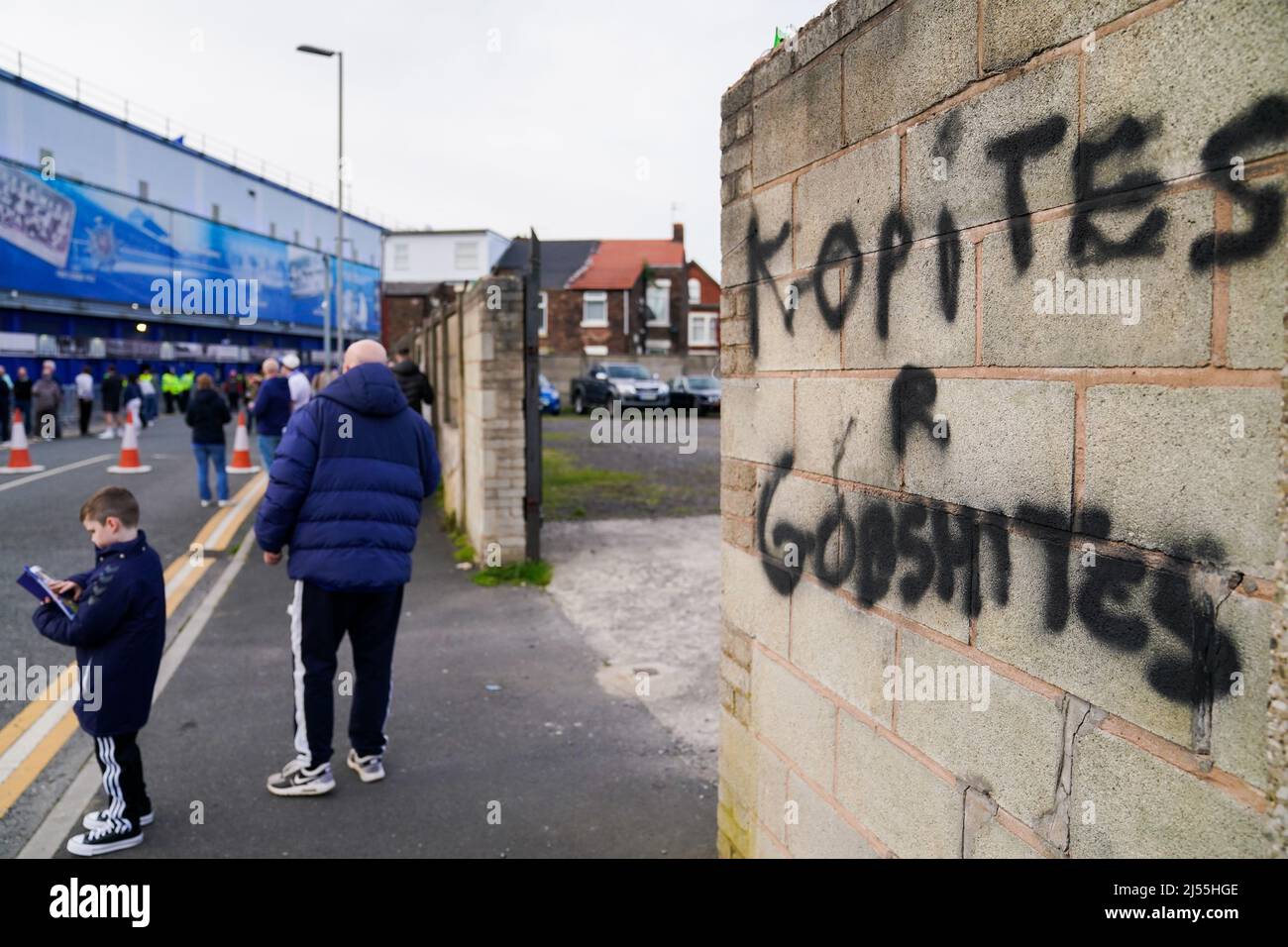 Graffiti reading "Kopites are gobshites" on a brick wall ahead of the ...