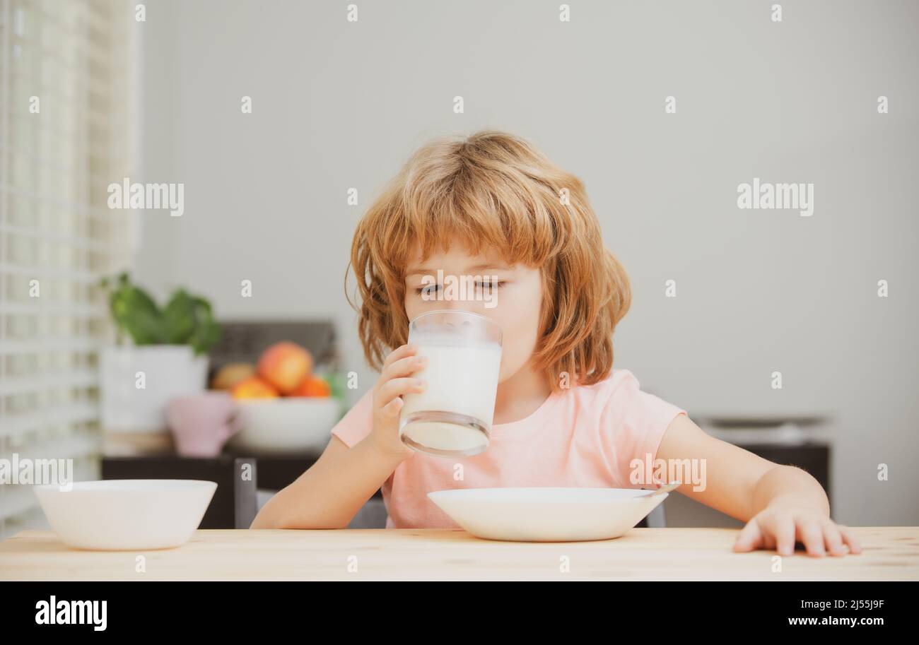 Organic milk with calcium. Little child drink milk. Kid eating healthy ...
