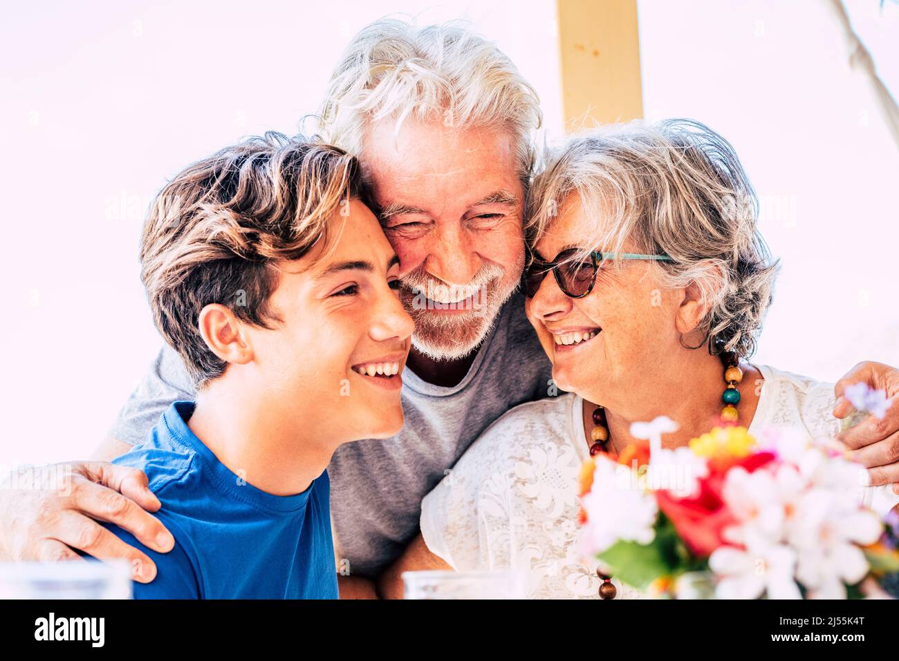 Happy family with grandfathers and grandson together laughing and ...