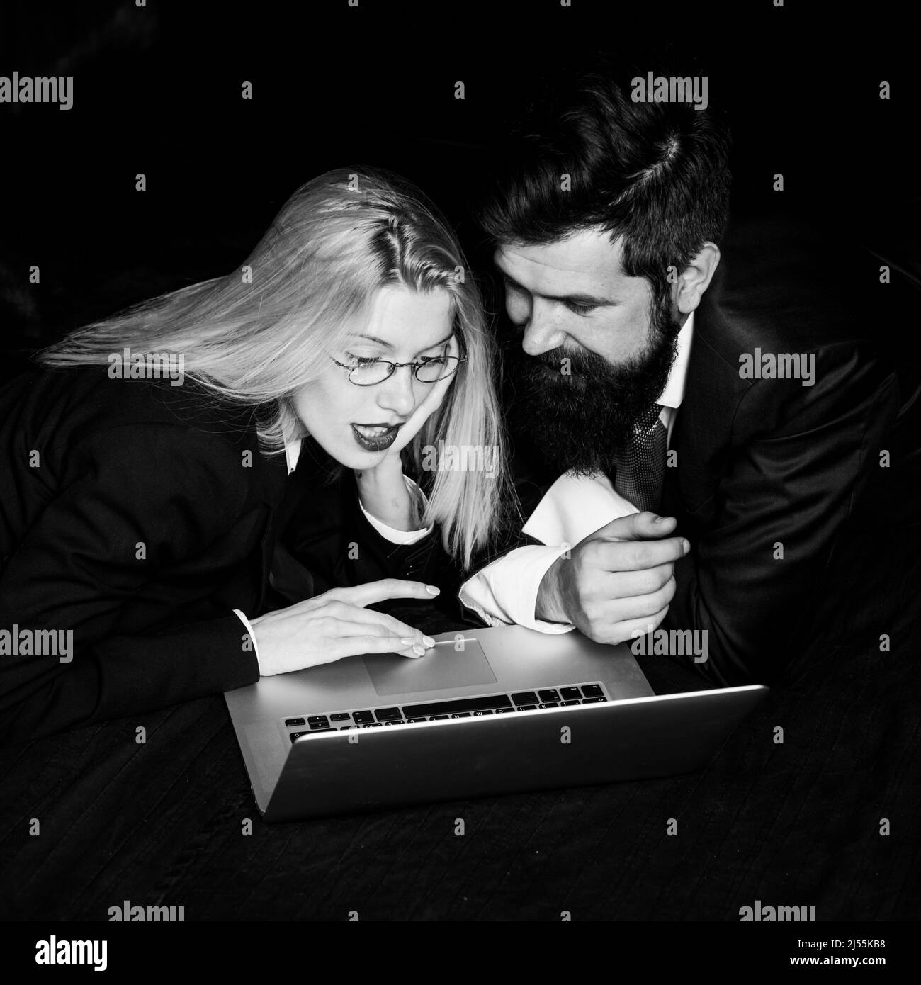 Business management. Working together on project. Two young business ...