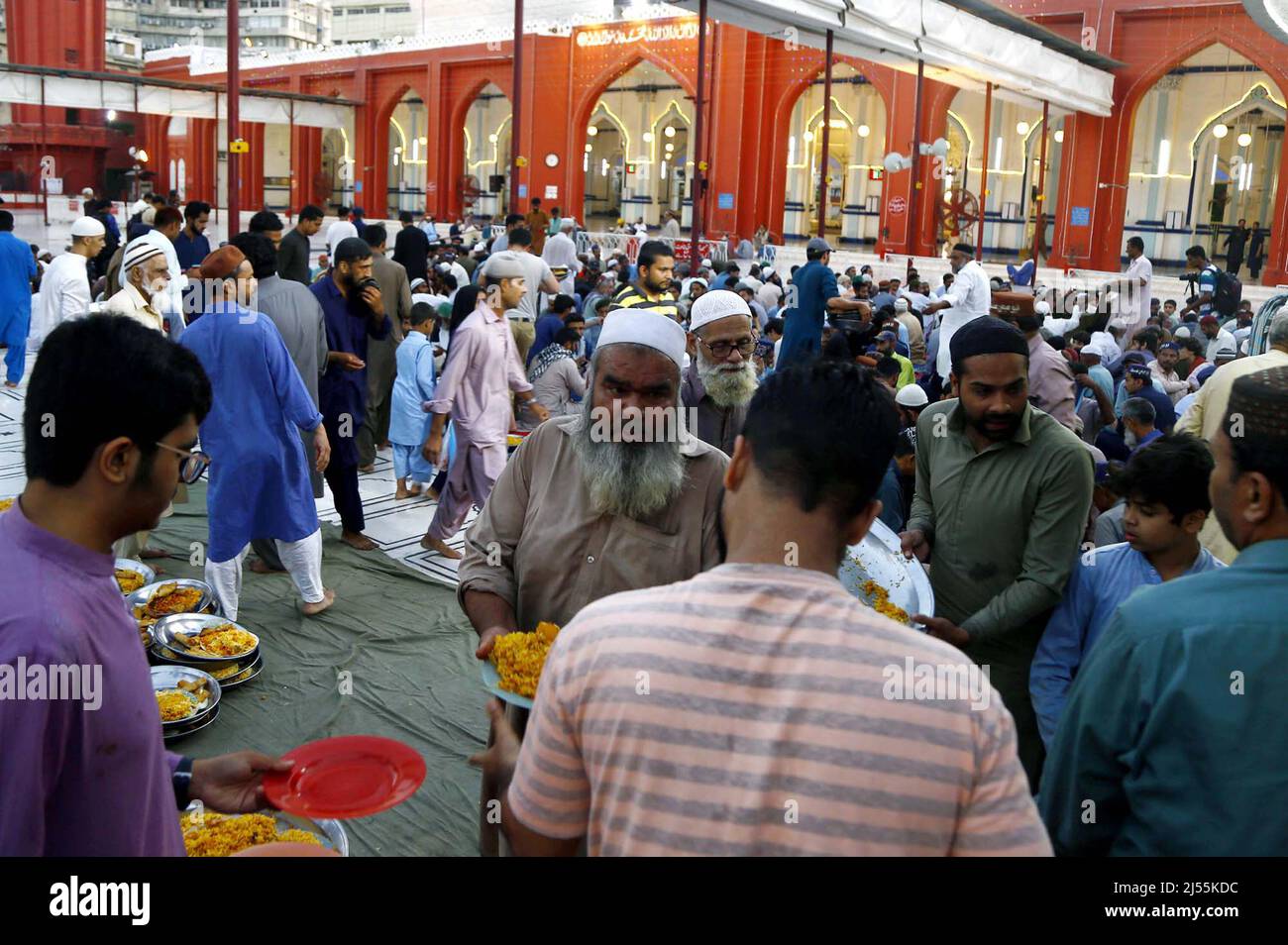 Faithful Muslims sit for Iftar (breaking fast meal), during the Holy ...