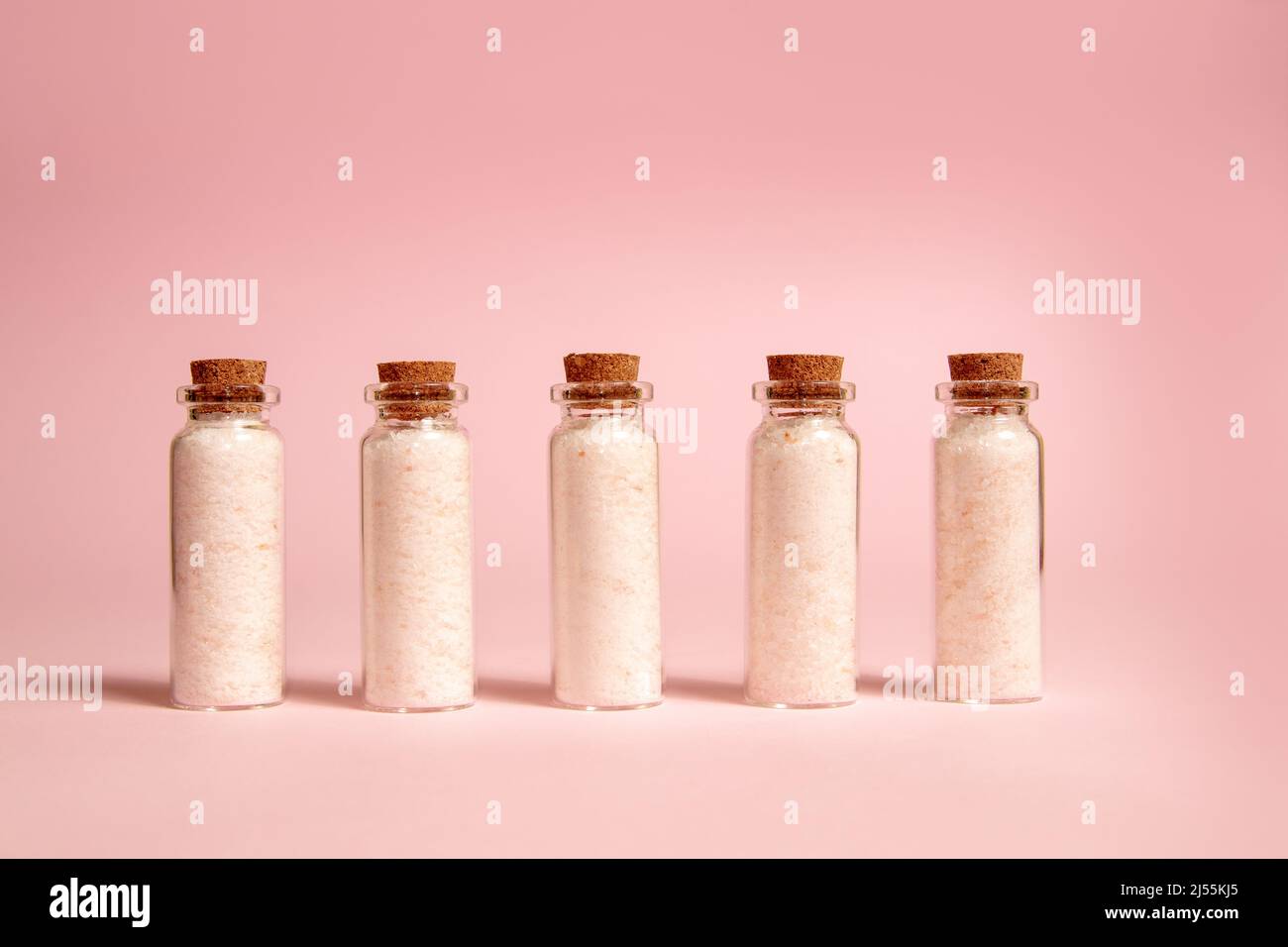 Pink Himalayan salt in glass bottles. Little bottles with cork stopper ...