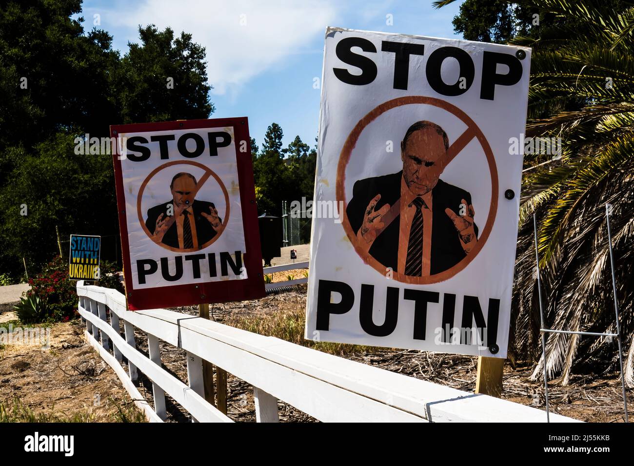 Anti-Putin placards on a roadside fence against the Russian war against ...