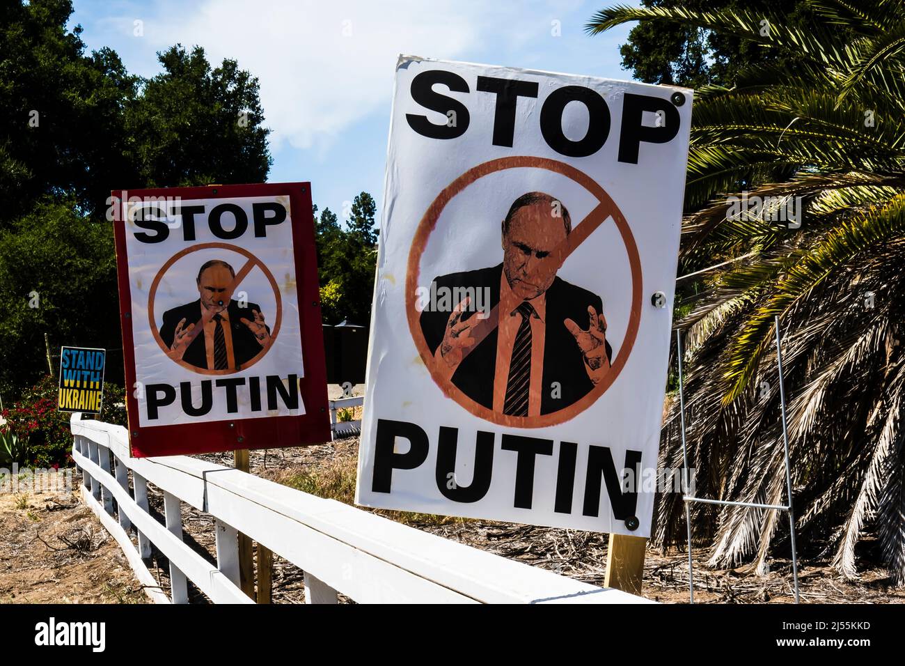 Anti-Putin placards on a roadside fence against the Russian war against ...