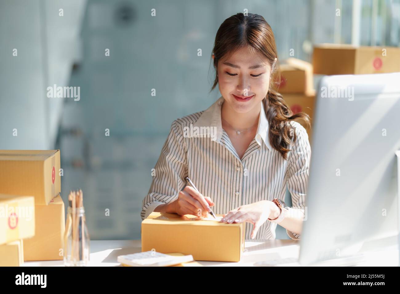 Asian small business owner working at home office. Business retail ...