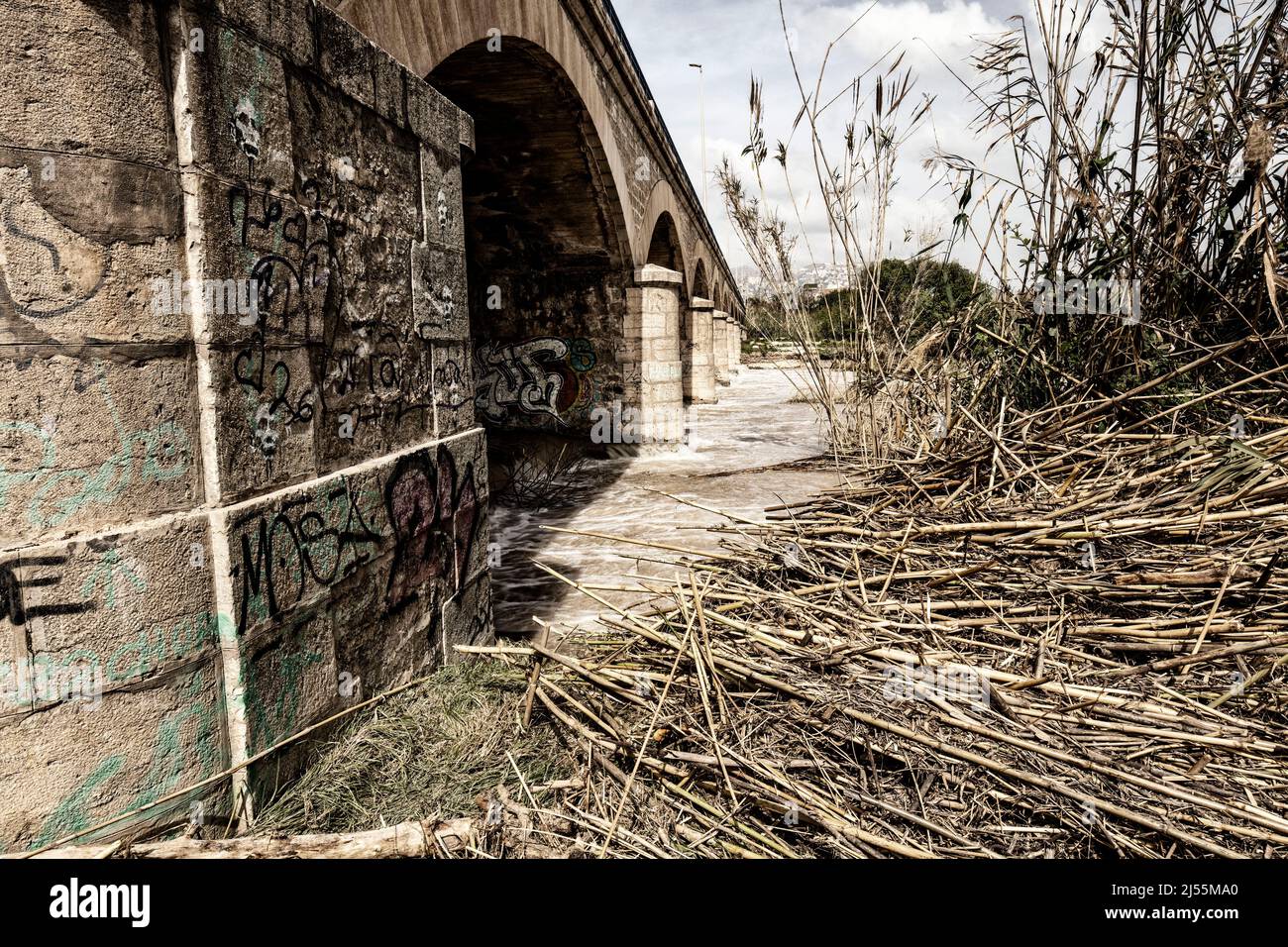 Natural landscape of Algar river in flood rushing under the road bridge ...