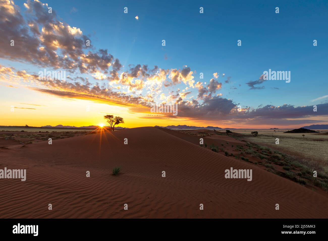 Yellow sunset and clouds at the dune in Namib Desert Namibia Stock ...