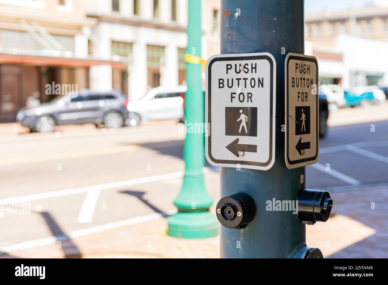 Cross walk sign for pedestrians to cross a downtown street Stock Photo ...