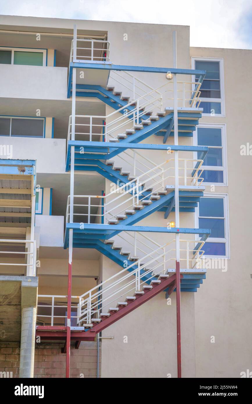 Perron staircase on a building with light blue and red beams at San ...