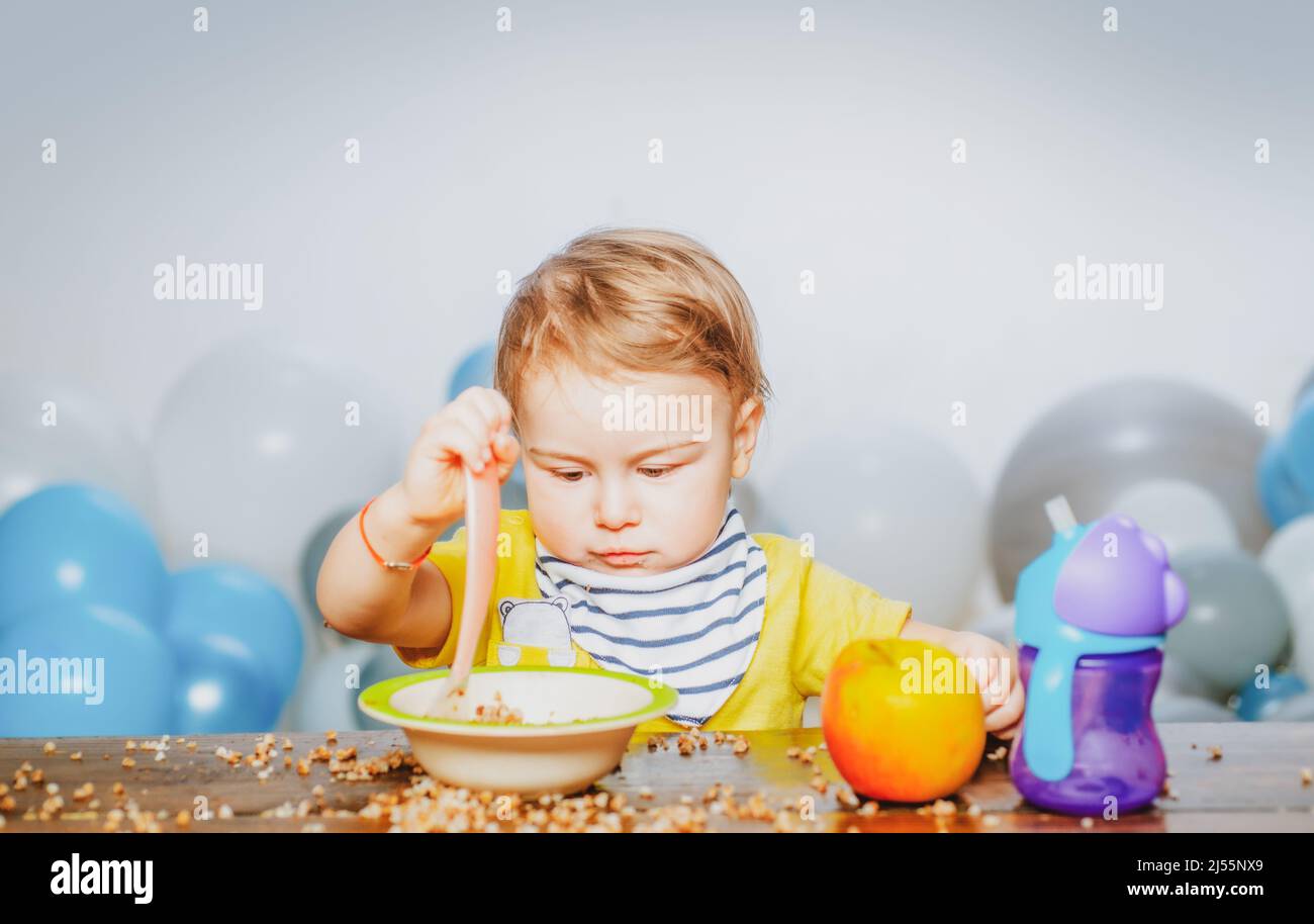 Cute baby food, babies eating. Funny kid boy with plate and spoon Stock ...