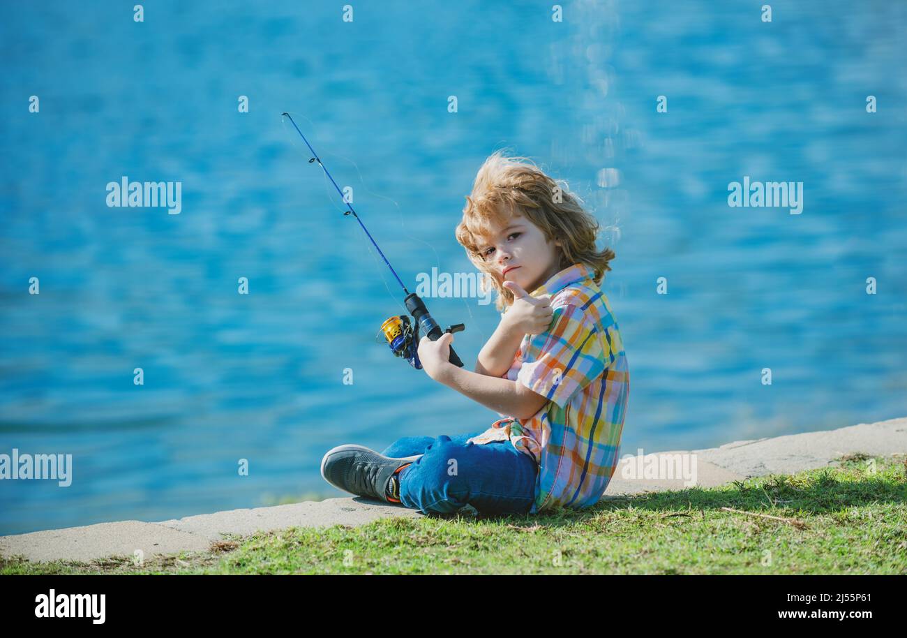 Child kid fisher. Boy with spinner at river. Little boy fishing. Boy at ...