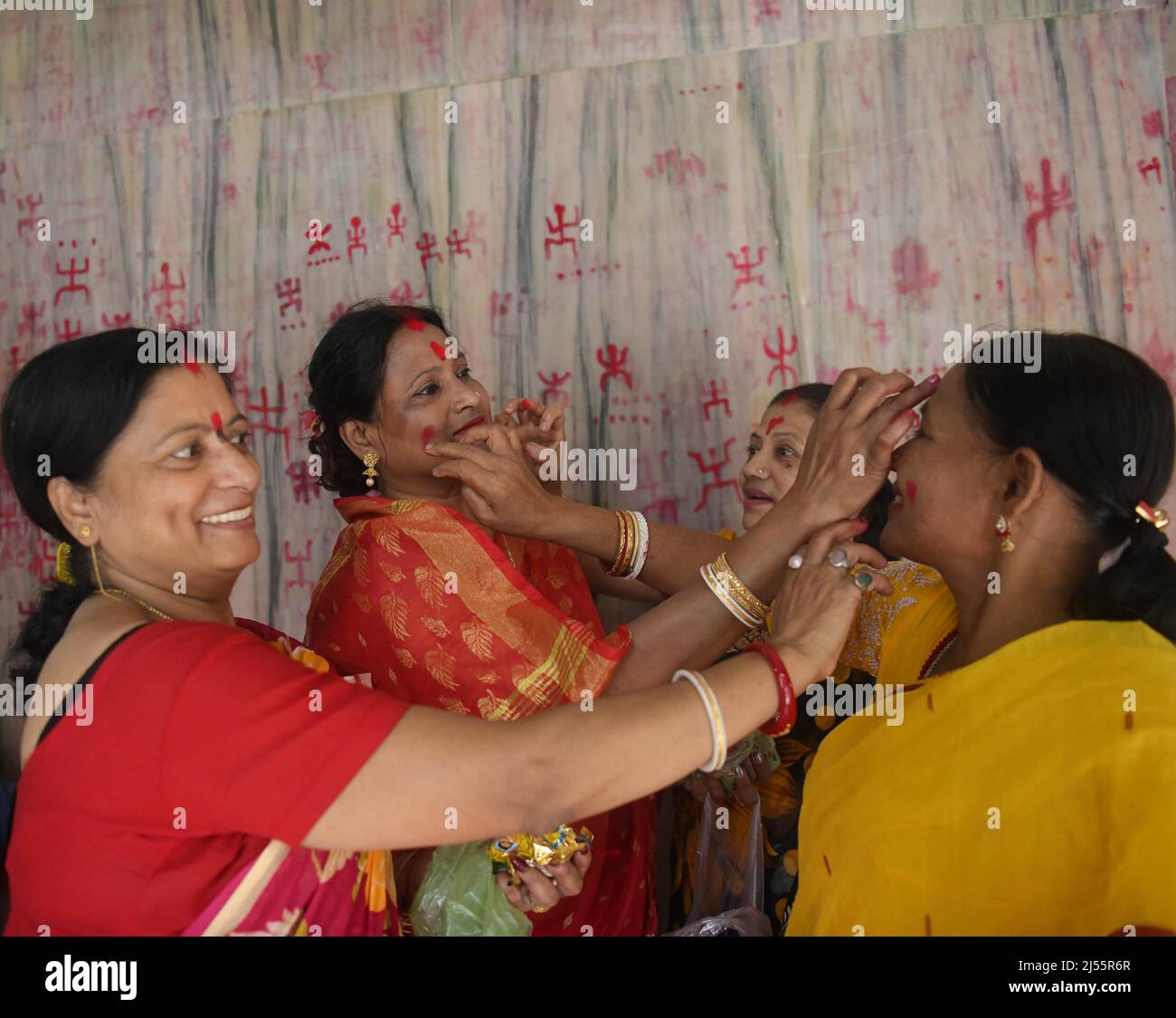 Female devotees share Sindur, red holy powder with each other at the ...