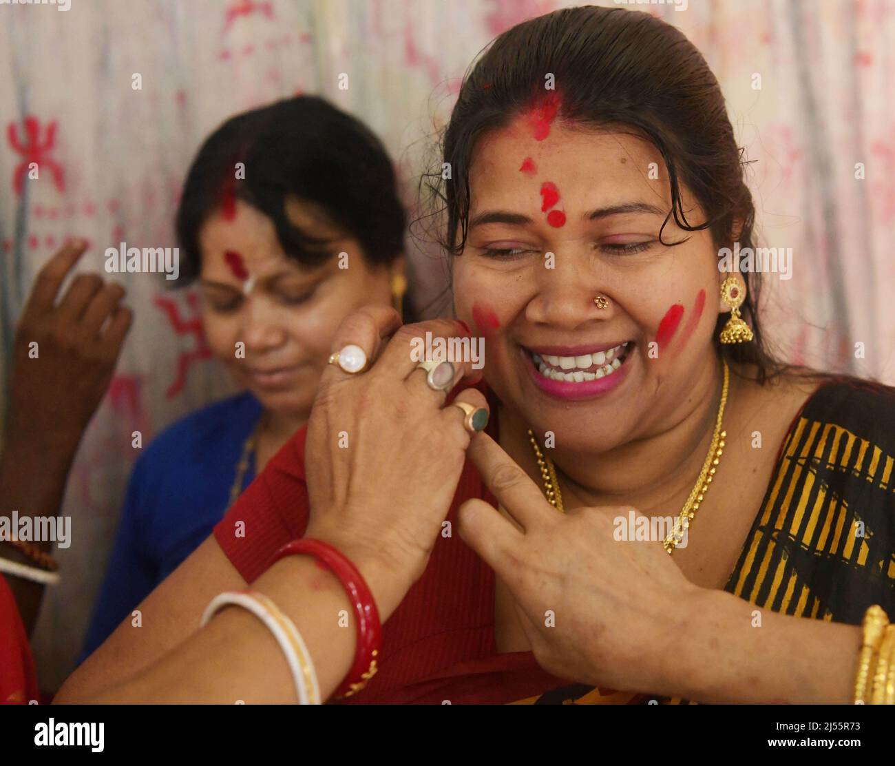 Female devotees share Sindur, red holy powder with each other at the ...