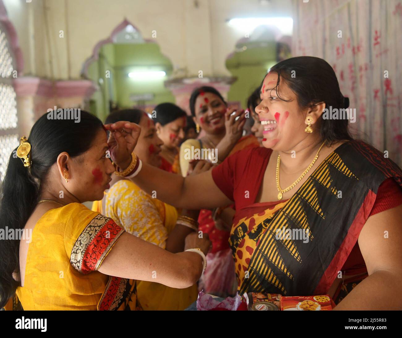 Female devotees share Sindur, red holy powder with each other at the ...