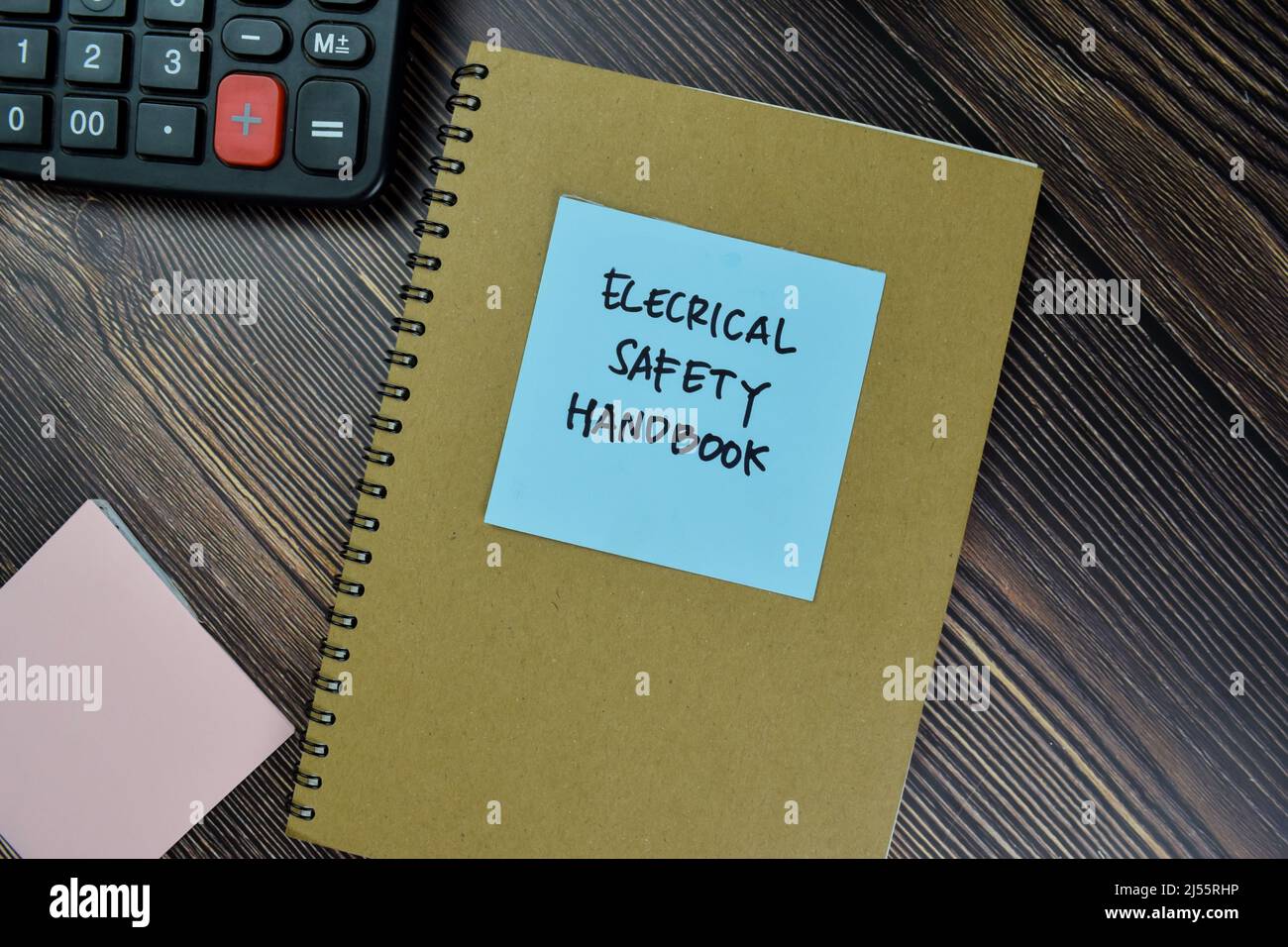 The book of Electrical Safety Handbook isolated on Wooden Table Stock ...