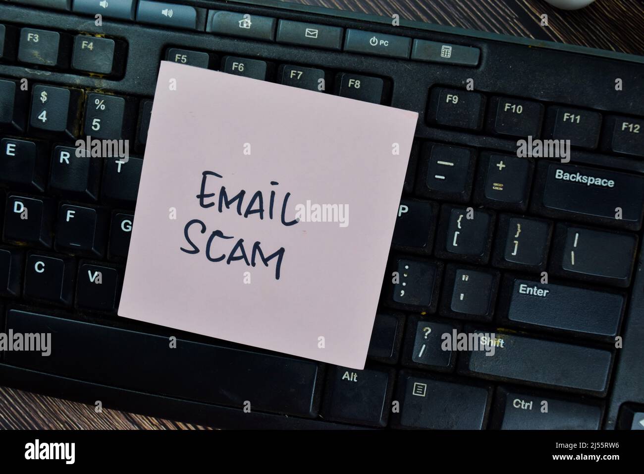 Email Scam write on sticky notes isolated on Wooden Table Stock Photo ...