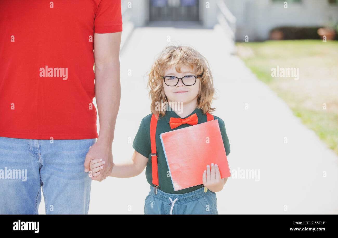 Kid nerd. School, family, education and outdoor concept. Parent holding ...