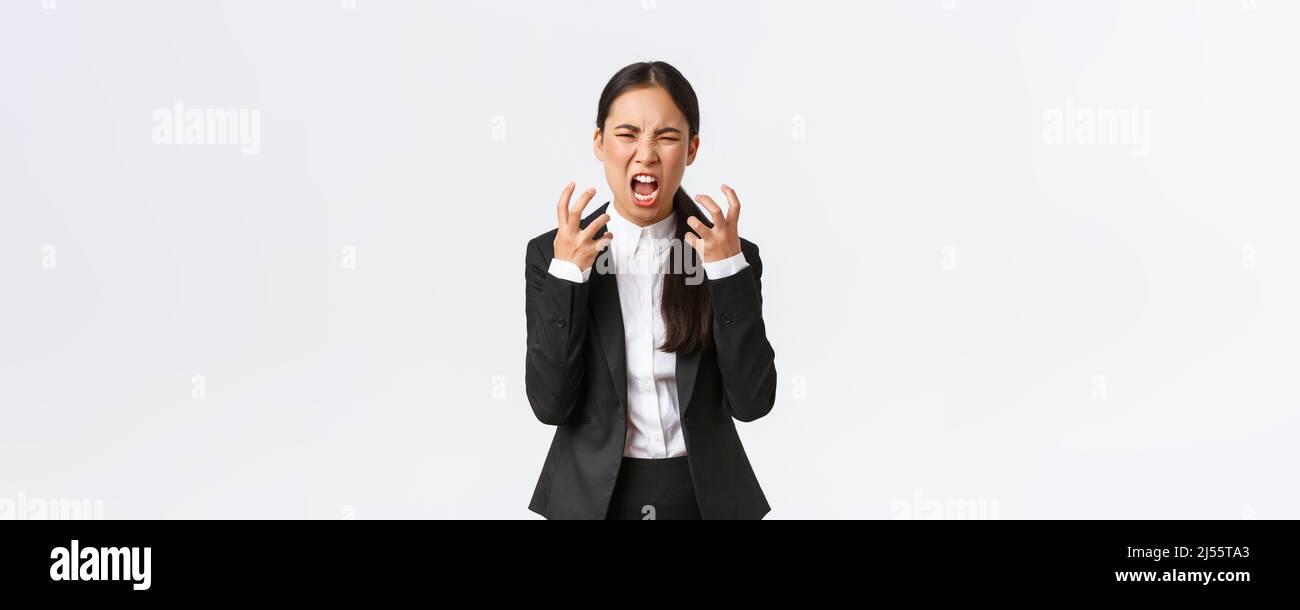 Mad disappointed CEO angry at employees. Outraged asian female manager ...