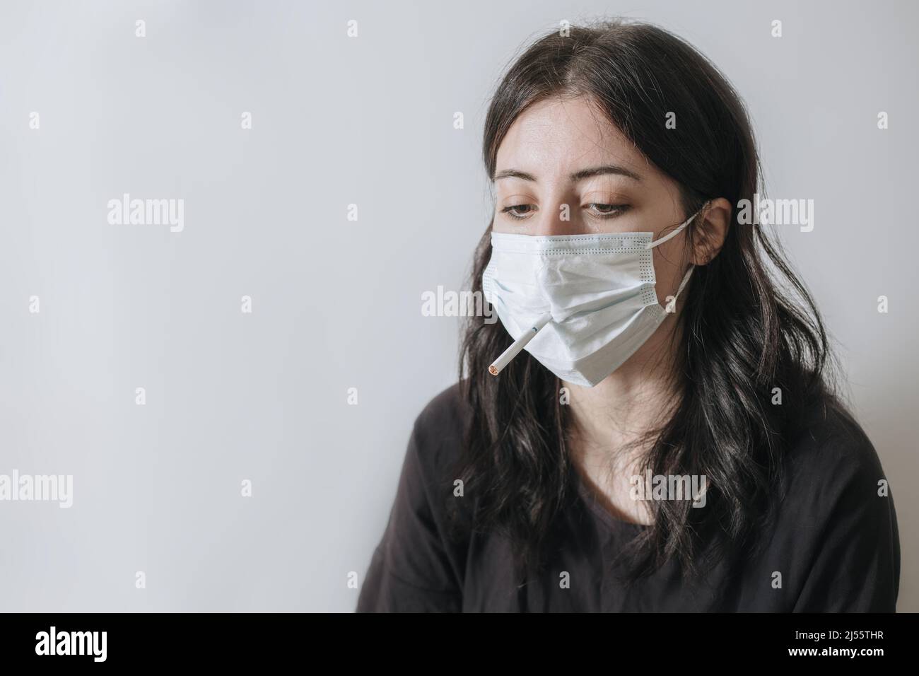 Senior woman hold a cigarette in mouth,withdrawal symptoms,cigarette ...