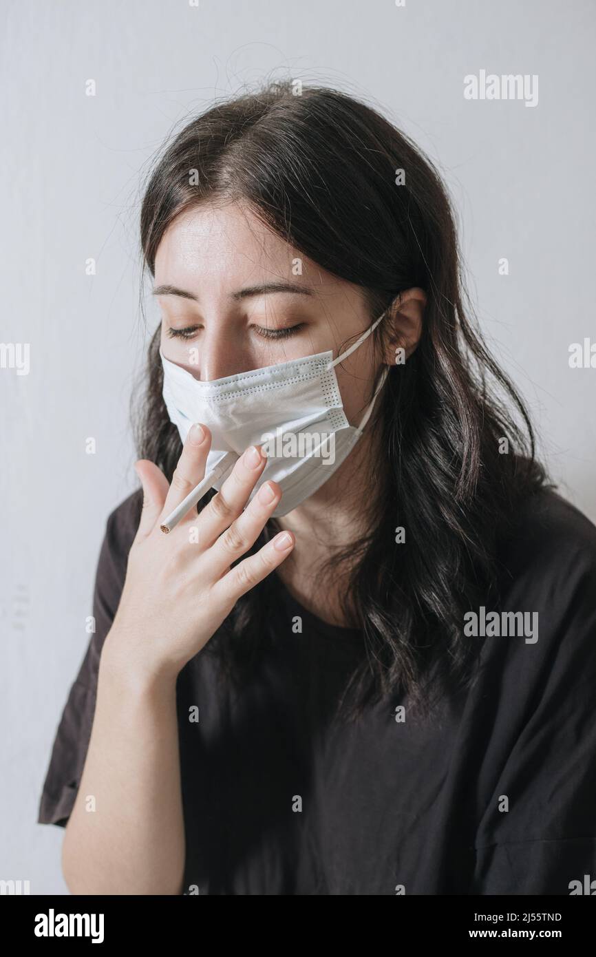 Senior woman hold a cigarette in mouth,withdrawal symptoms,cigarette ...