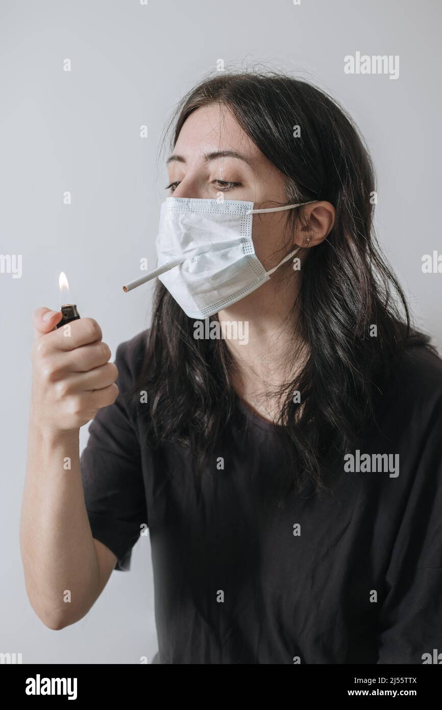 Senior woman hold a cigarette in mouth,withdrawal symptoms,cigarette ...