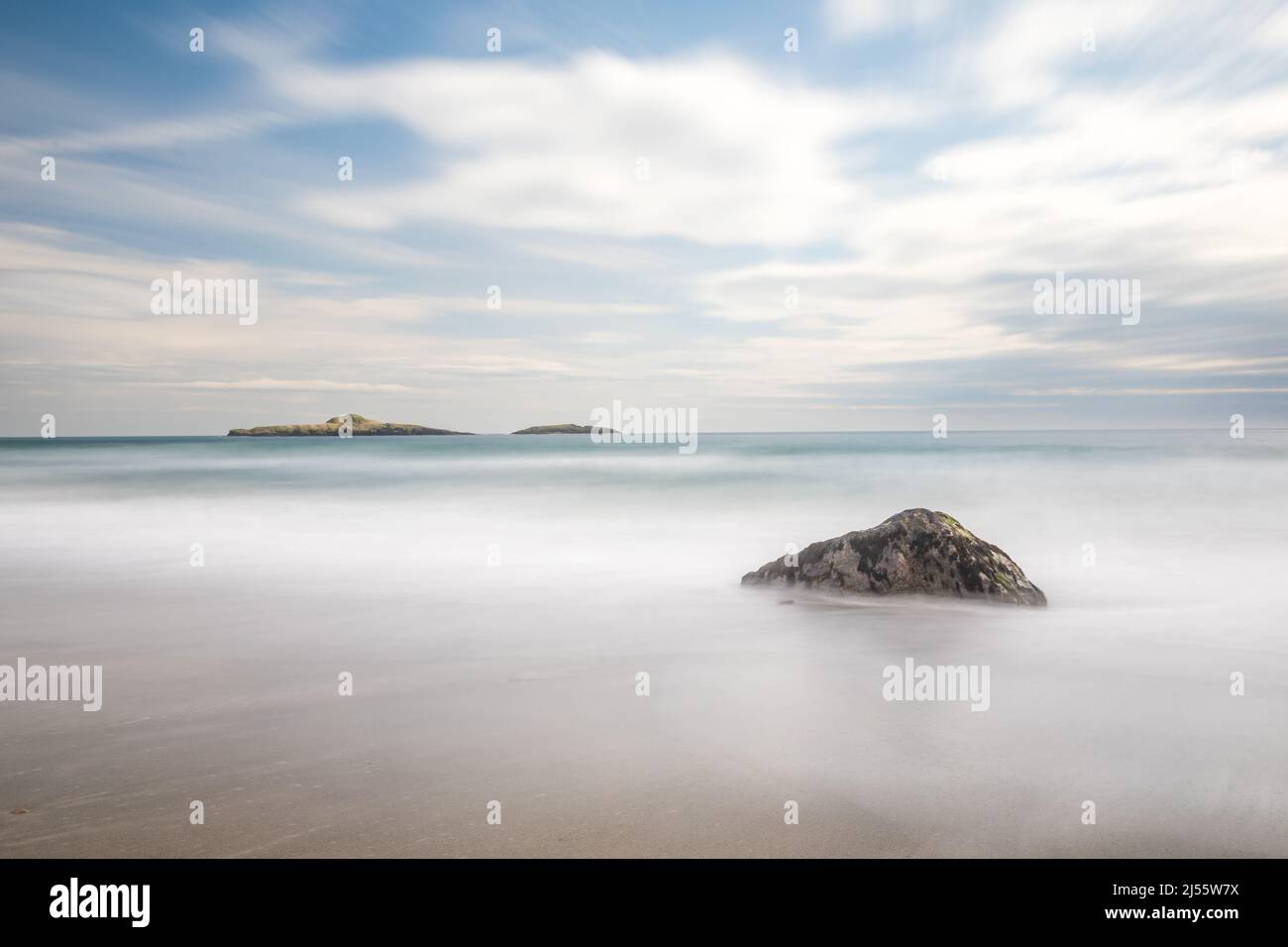 High tide at Aberdaron beach, with Ynys Gwylan-fawr and Ynys Gywlan ...