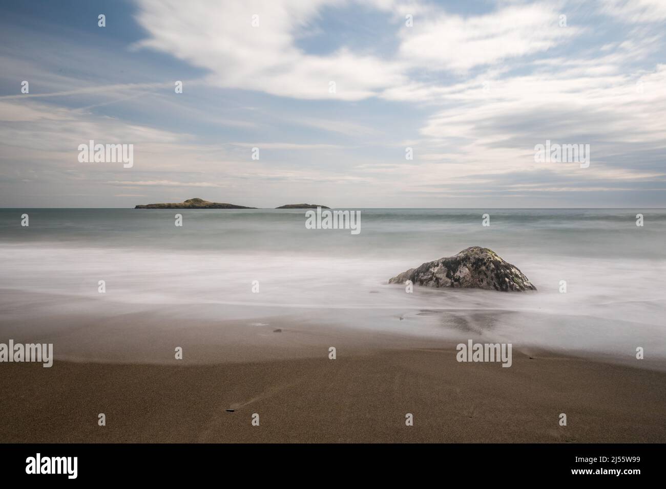 High tide at Aberdaron beach, with Ynys Gwylan-fawr and Ynys Gywlan ...