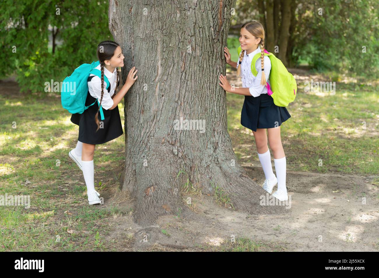 happy kids having fun together in park after school Stock Photo - Alamy