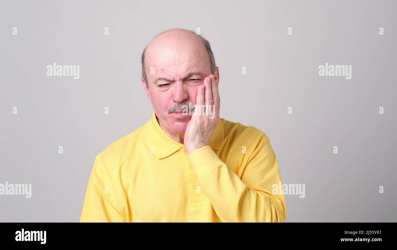 Senior man suffering with terrible toothache. Problems with teeth at ...