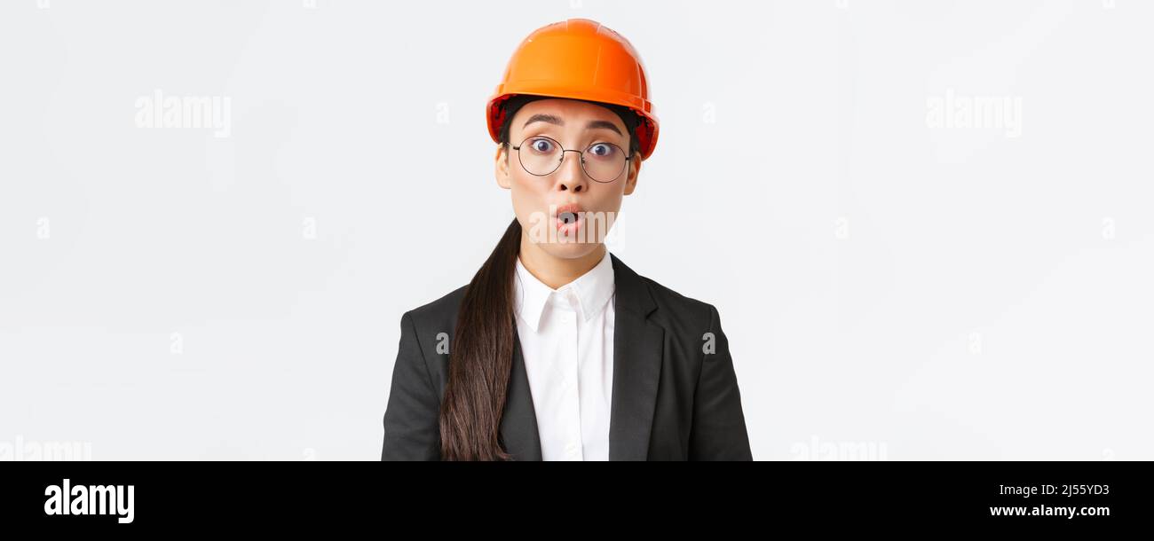 Close-up of shocked and concerned asian female engineer hear bad news ...