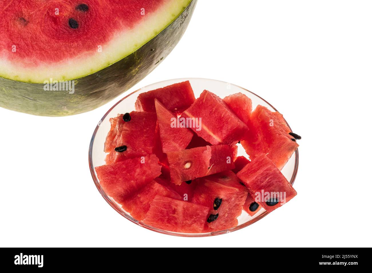 Close up view of whole and plate of diced watermelon isolated on white ...