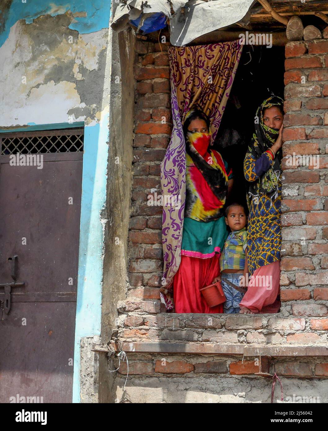 New Delhi, India. 20th Apr, 2022. Local residents look on a after a ...
