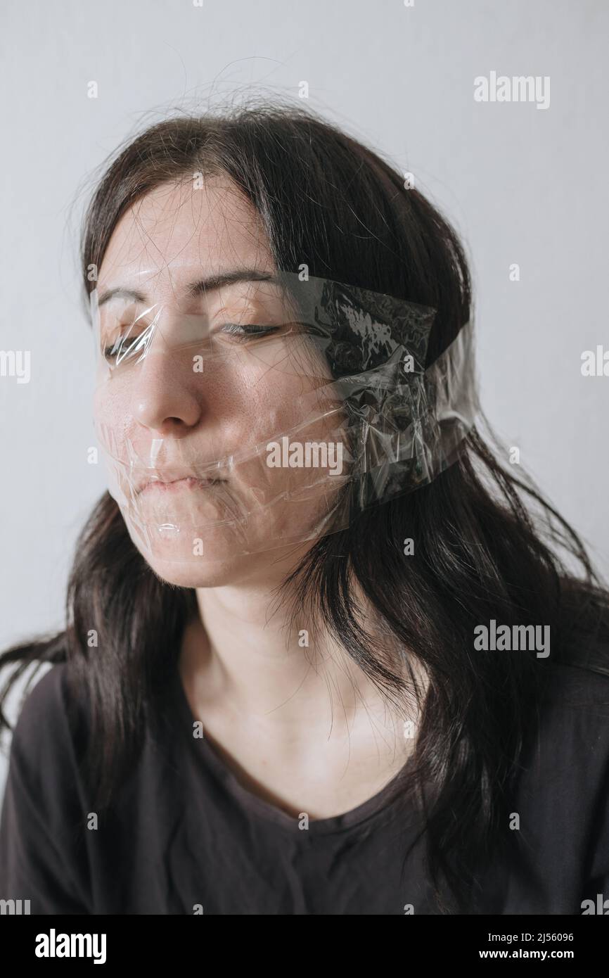Girl taped mouth hi-res stock photography and images - Alamy