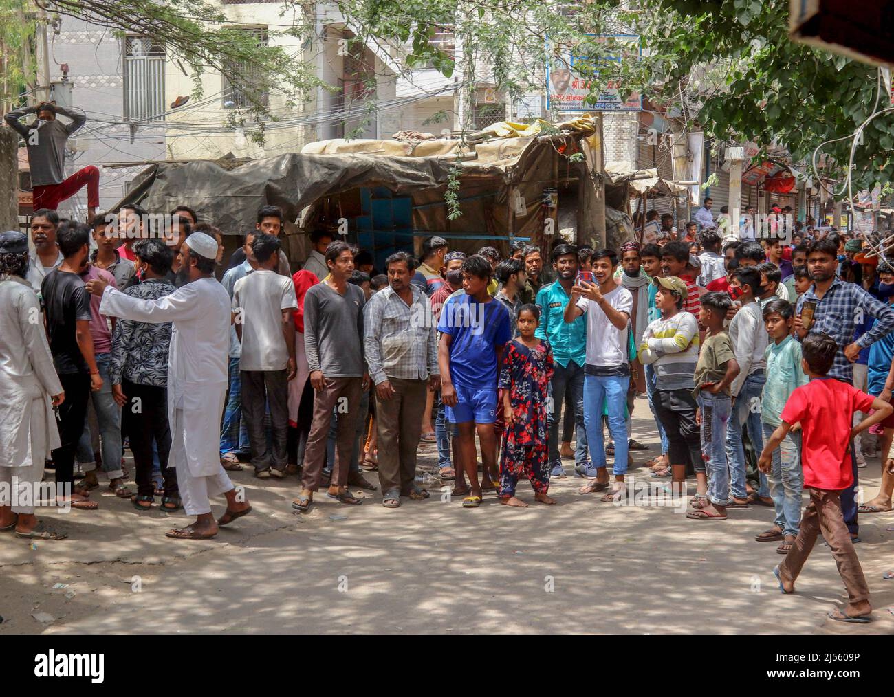 New Delhi, India. 20th Apr, 2022. Local residents seen on the street as ...