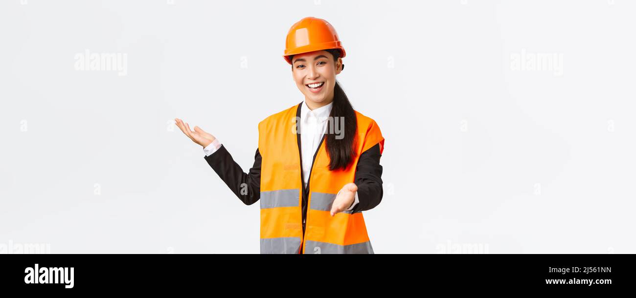 Smiling successful female asian construction manager, architect ...