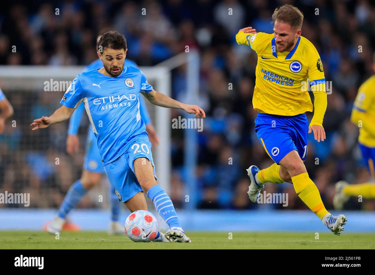 Bernardo Silva #20 of Manchester City tries to escape from Alexis Mac Allister #10 of Brighton ...