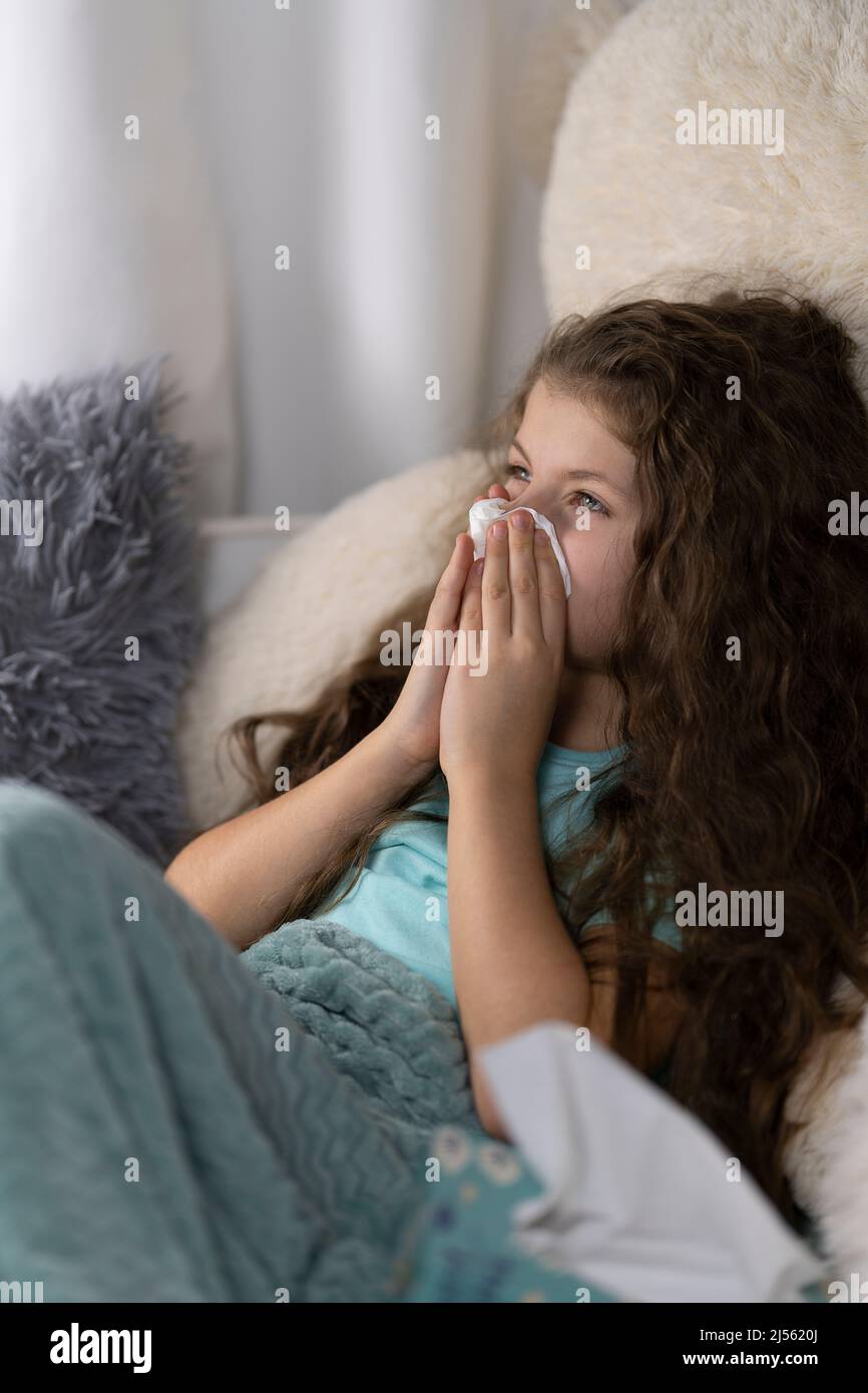 little girl cold with runny nose under the blanket Stock Photo - Alamy
