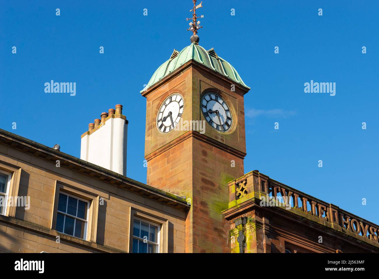 Beautiful old clock tower in English city on a sunny Spring morning ...