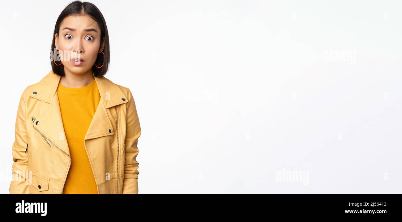 Image of shocked, confused asian woman, staring frustrated and ...