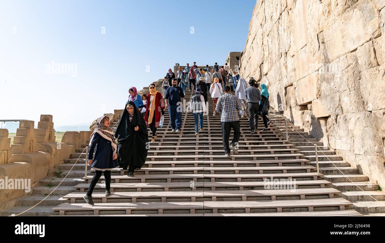 Persepolis, Iran - May 2019: Tourists visiting ruins of Persepolis, the ...