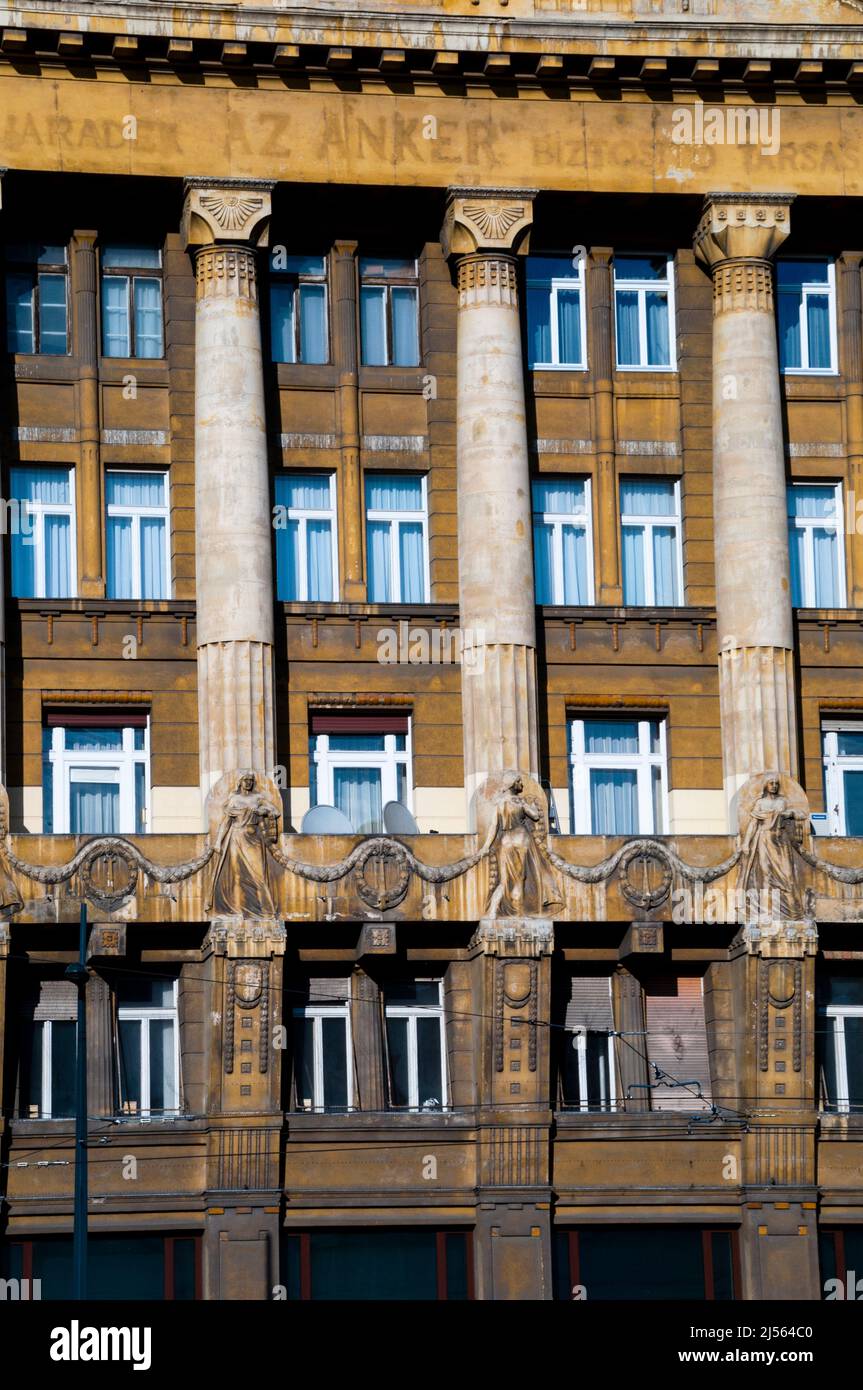 Fluted half columns, bas relief statues and wreaths on a historic ...