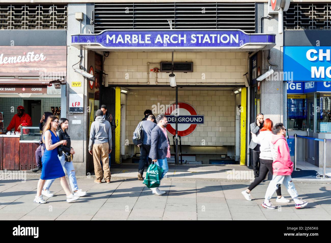 People walking past Marble Arch underground station on Oxford Street ...