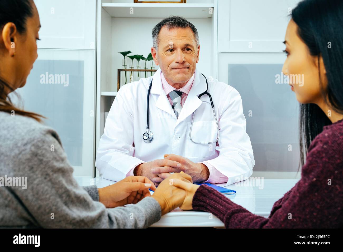 Concerned doctor physician practitioner and worried patients in ...