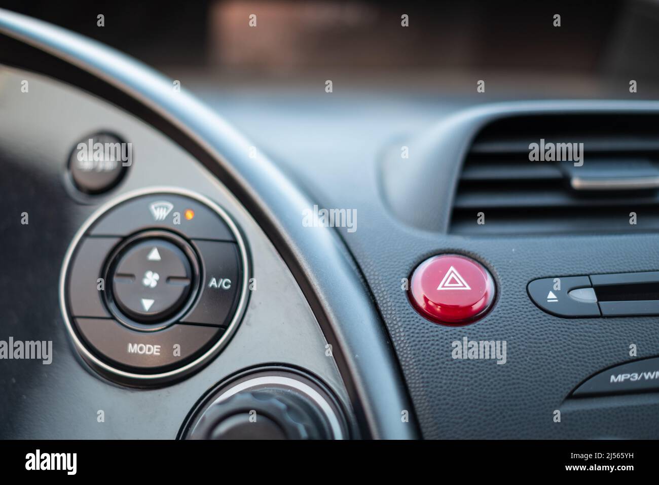 Red emergency button light in a dark car cockpit Stock Photo - Alamy