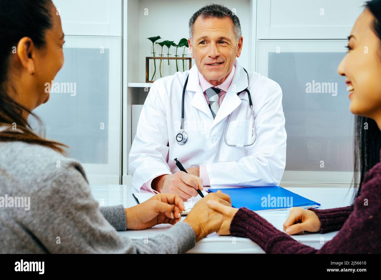 doctor and happy patients in hospital physician practitioner healthcare ...